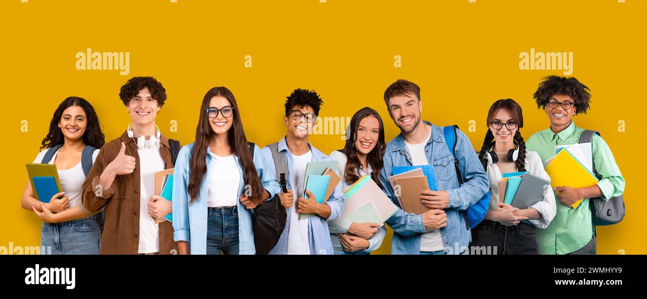 Six university students with cheerful expressions, holding notebooks ...