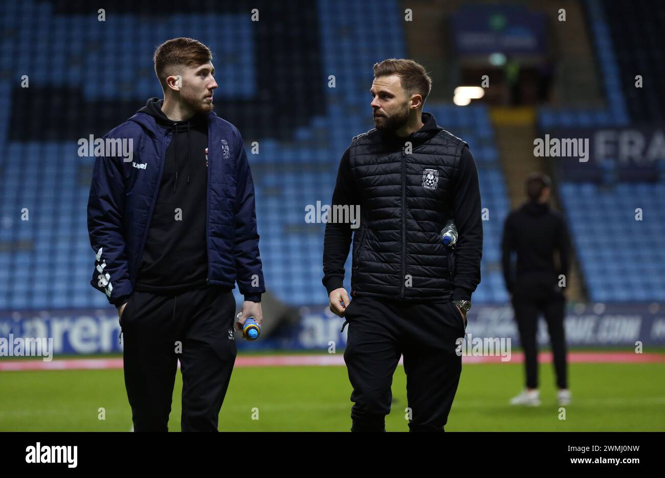 Coventry City's Josh Eccles (left) and Matthew Godden on the pitch ...