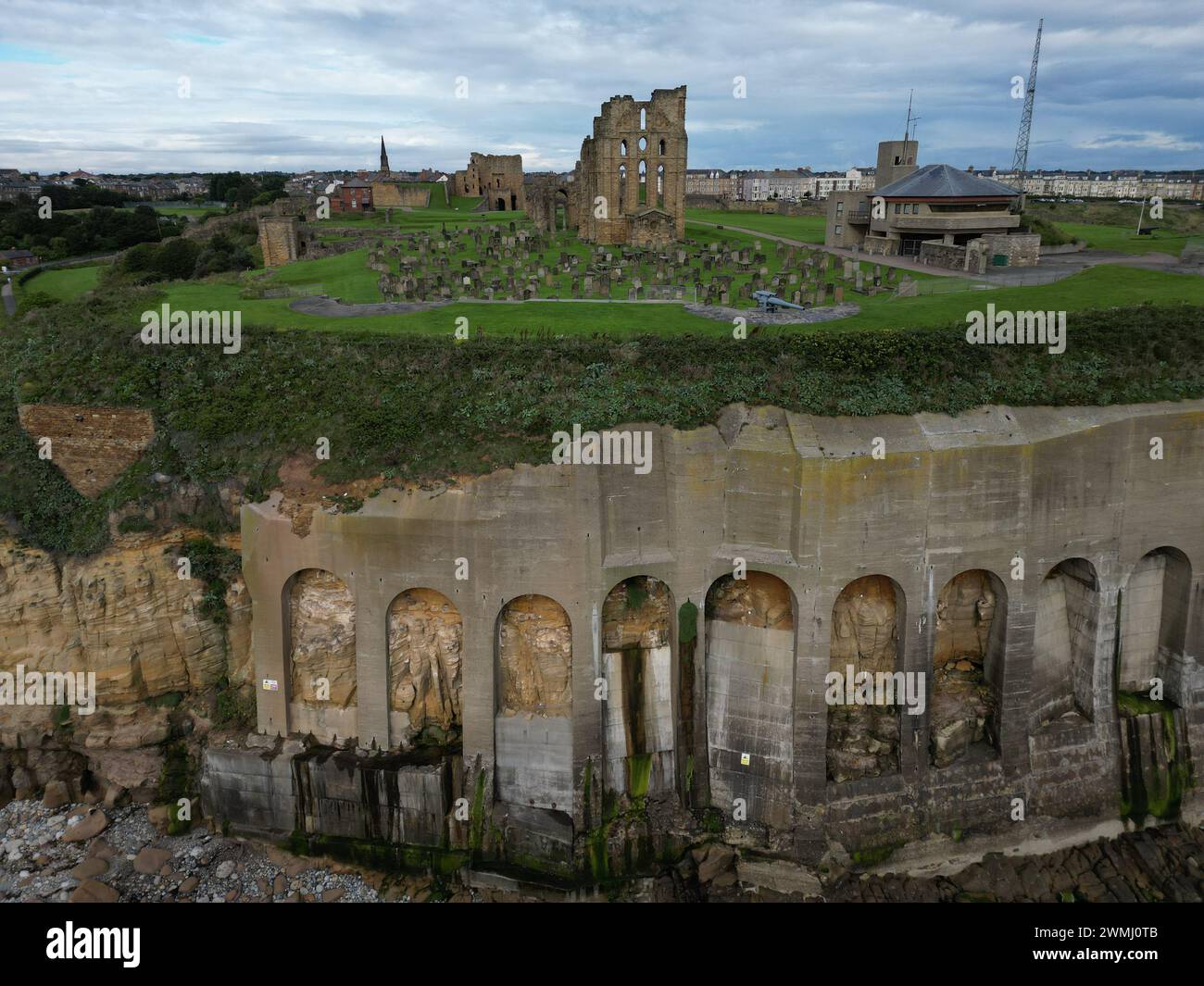 Stone bridge in front of castle ruins and grassy surroundings Stock ...