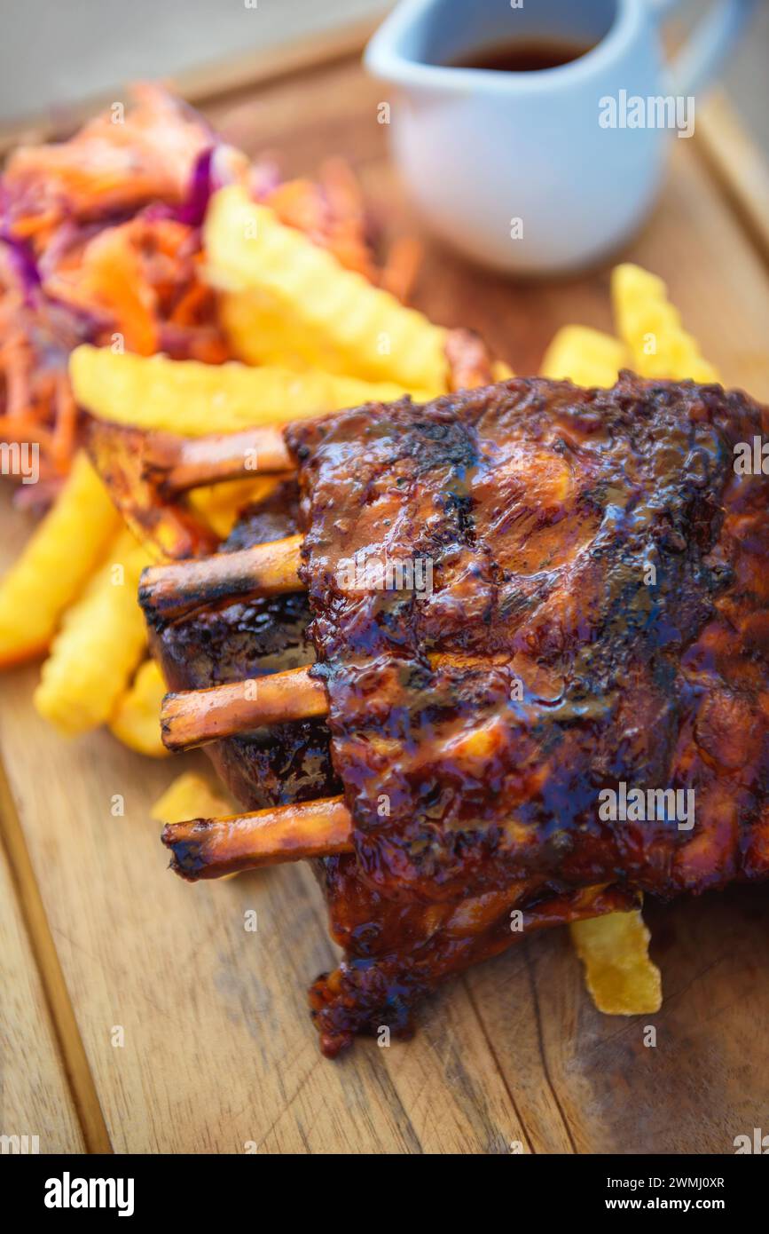 BBQ Ribs With Fries And Sauce Stock Photo - Alamy