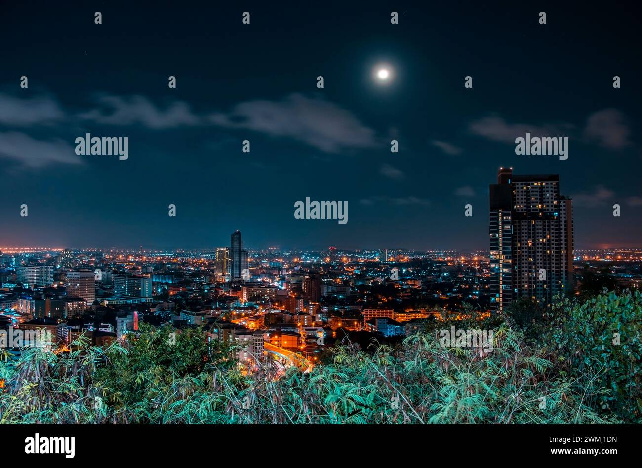 night view of pattaya with full moon Stock Photo - Alamy