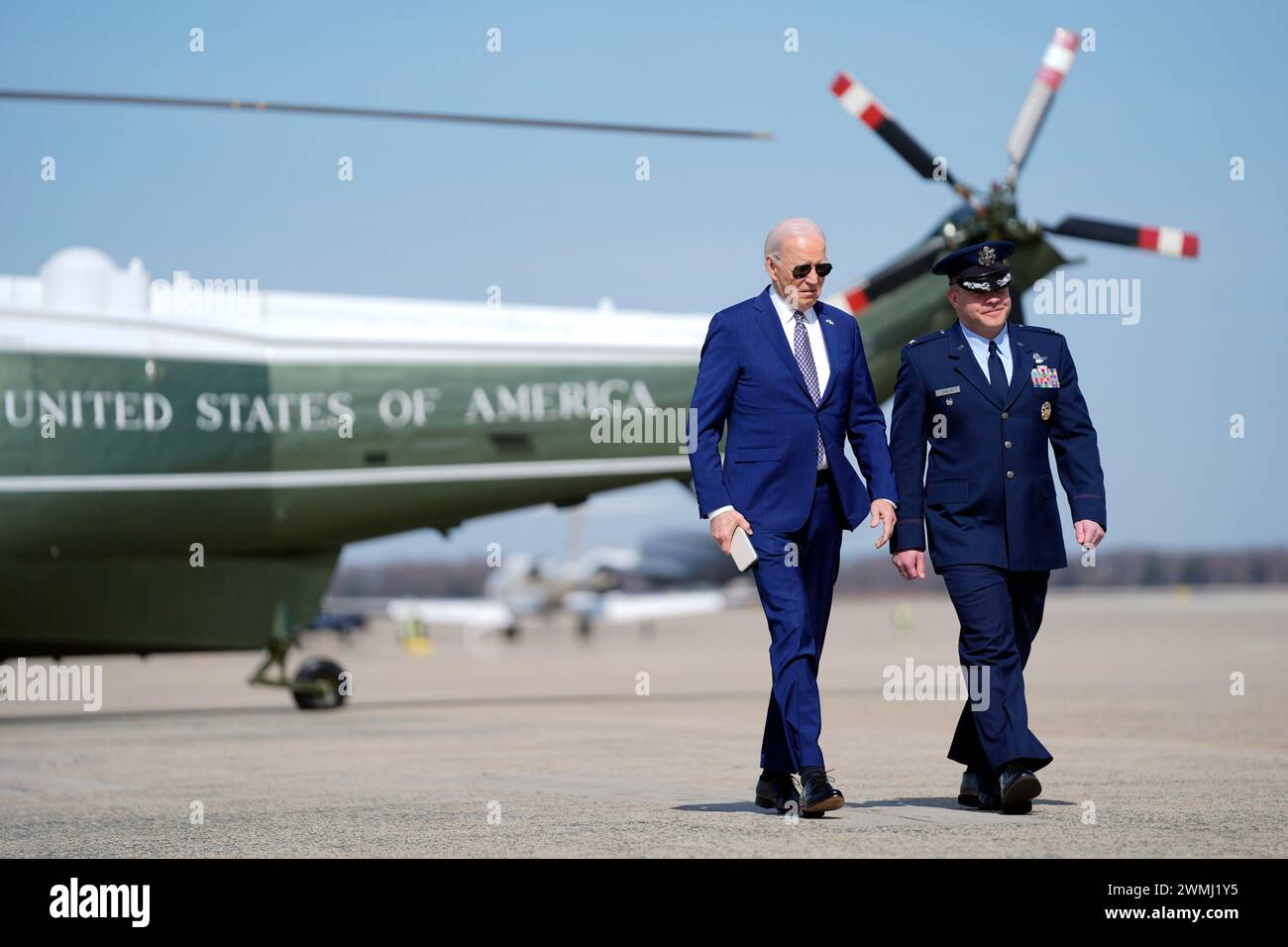 President Joe Biden walks to board Air Force One with Col. Paul Pawluk ...
