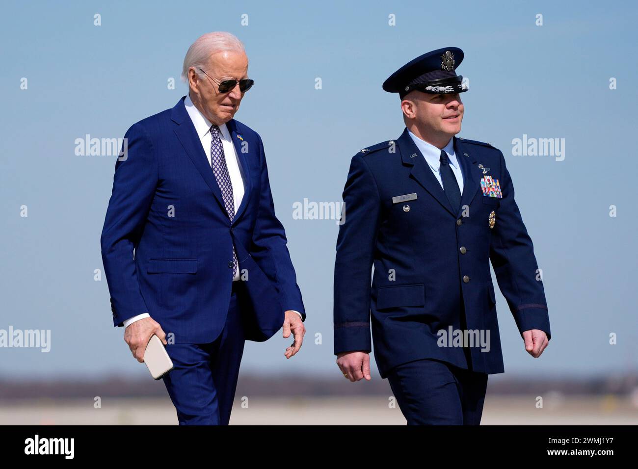 President Joe Biden walks to board Air Force One with Col. Paul Pawluk ...