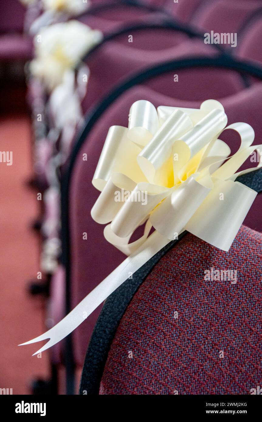 White ribbon on chairs Stock Photo - Alamy
