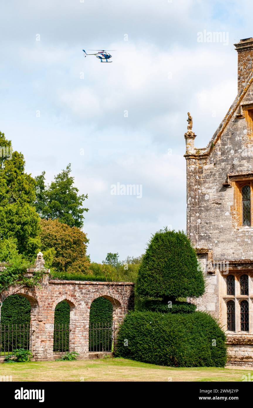 Helicopter over Country House Stock Photo - Alamy