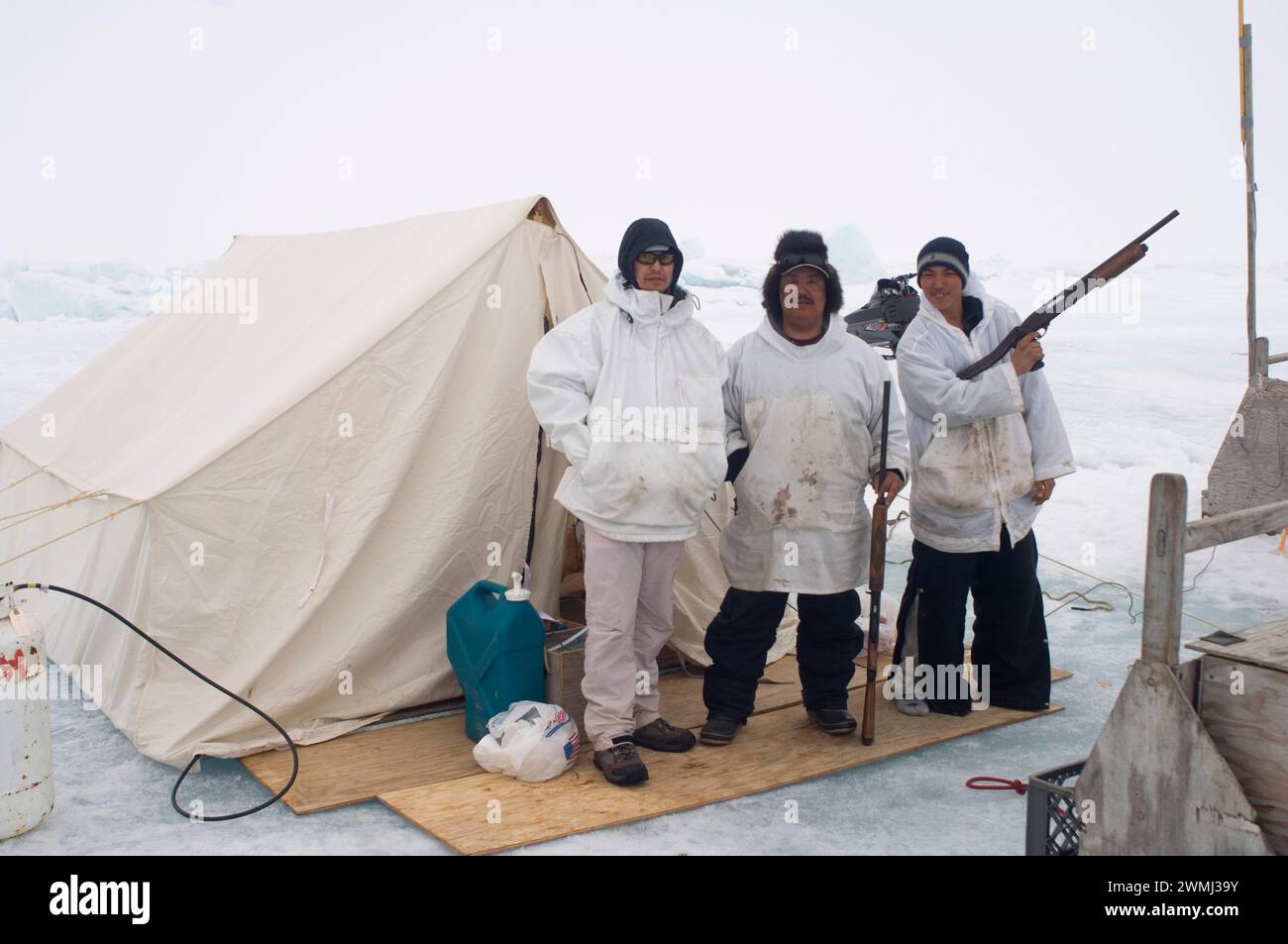 Hopson One spring whaling crew members at camp on a flat pan of ice ...