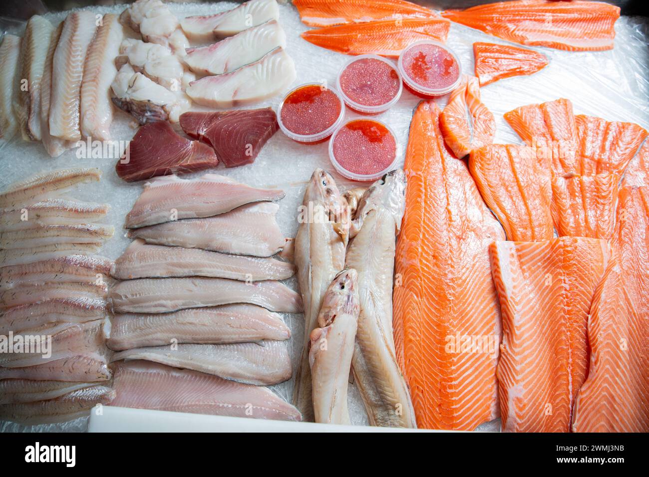 Fresh fish and seafood counter on market. Salmon, trout and white fish ...