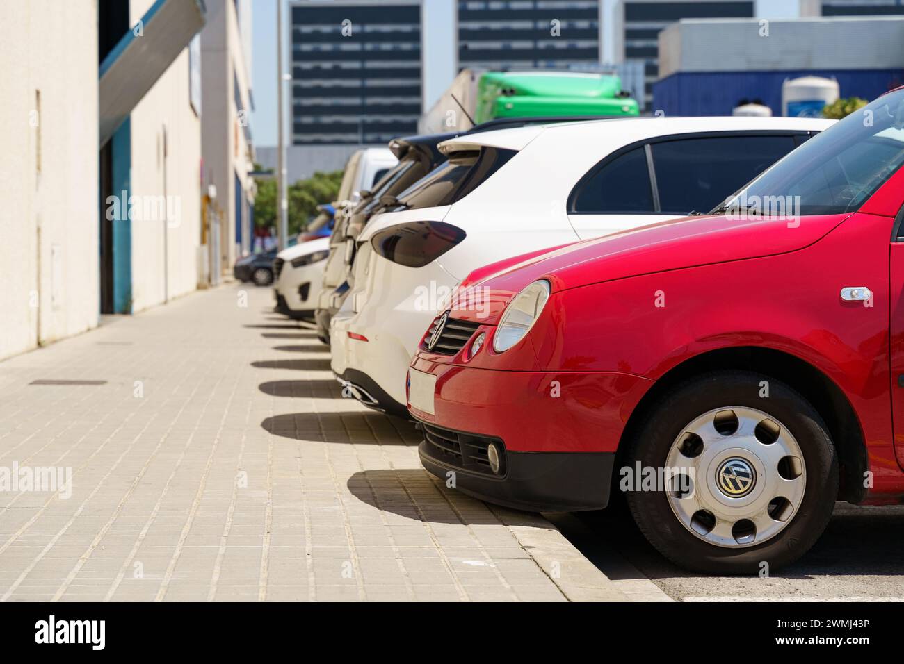 Barcelona, Spain - May 8, 2023: A line of cars parked closely next to ...