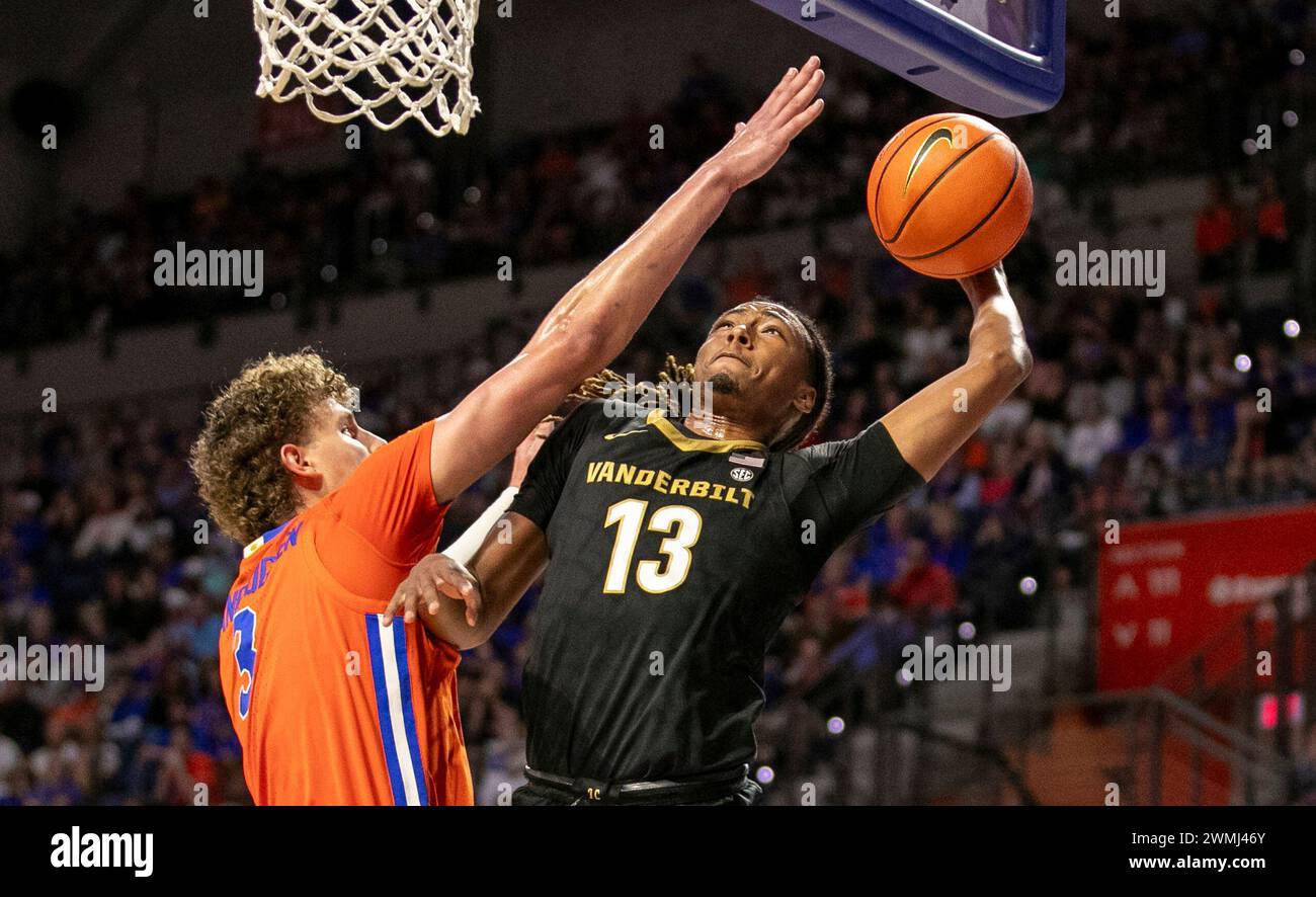 Vanderbilt guard Malik Presley (13) shoots against Florida center Micah ...