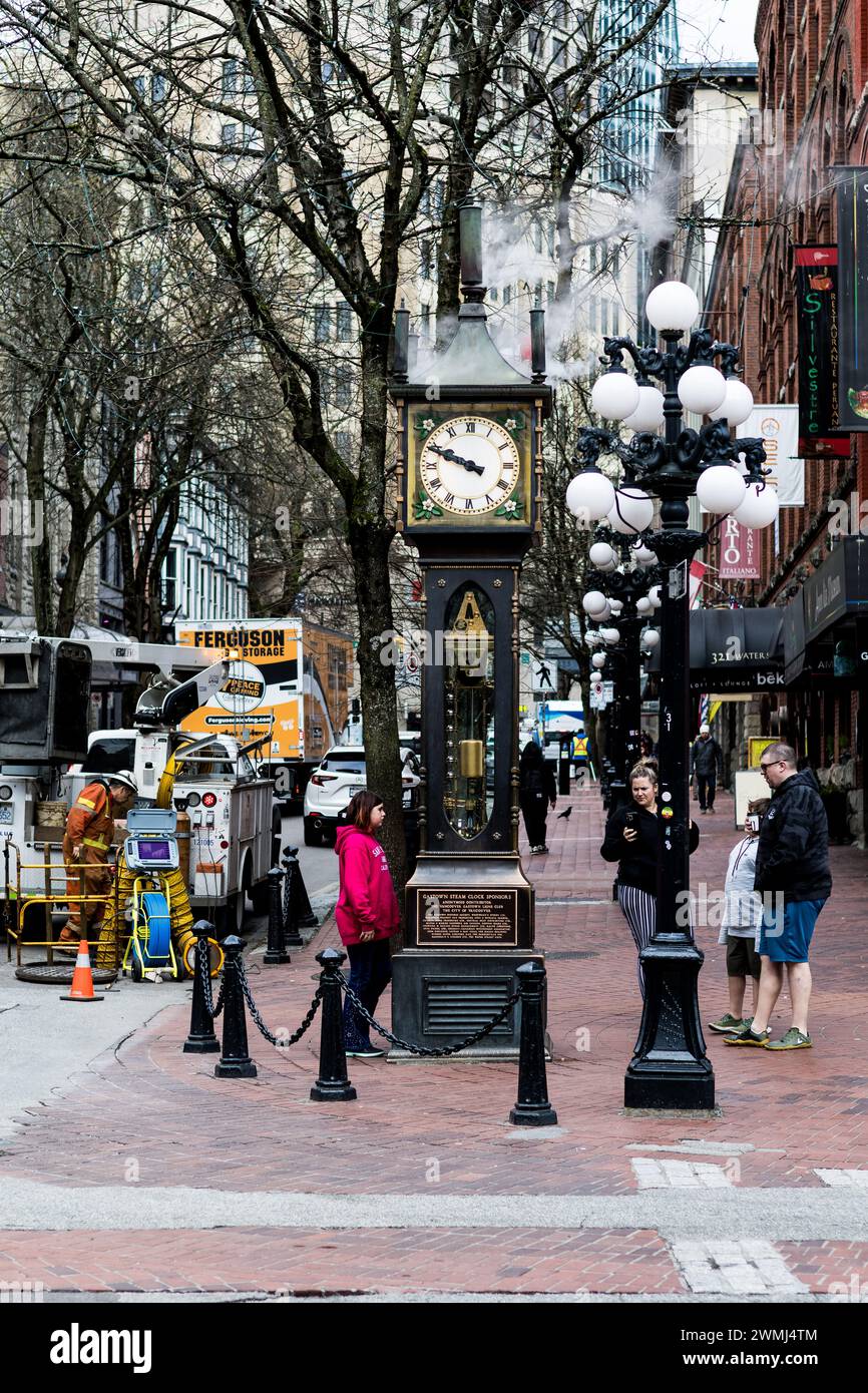A view of the Steam Clock in Gastown, with steam coming out of its top ...