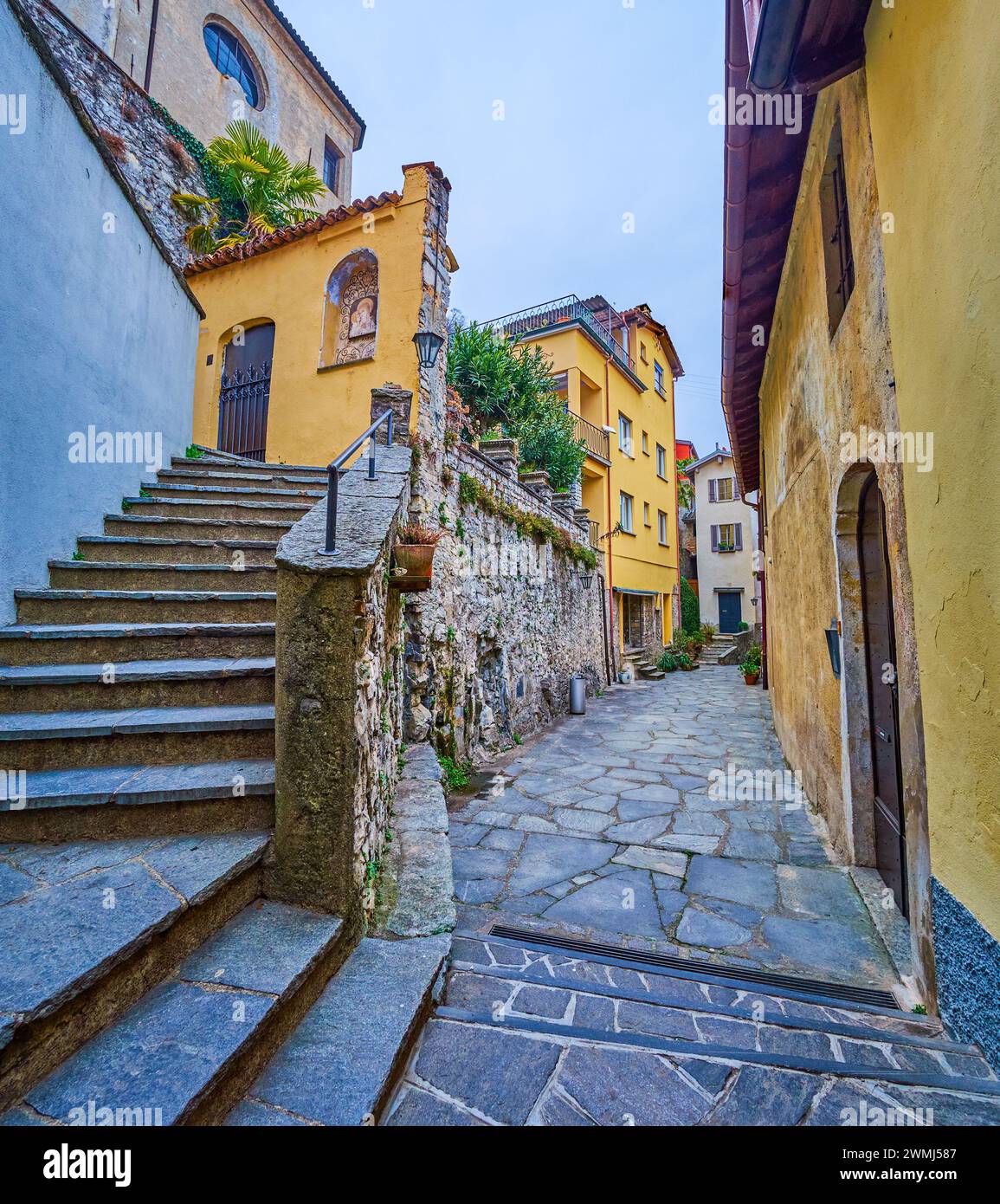 Narrow street with steep staircases in old mountain Gandria village ...