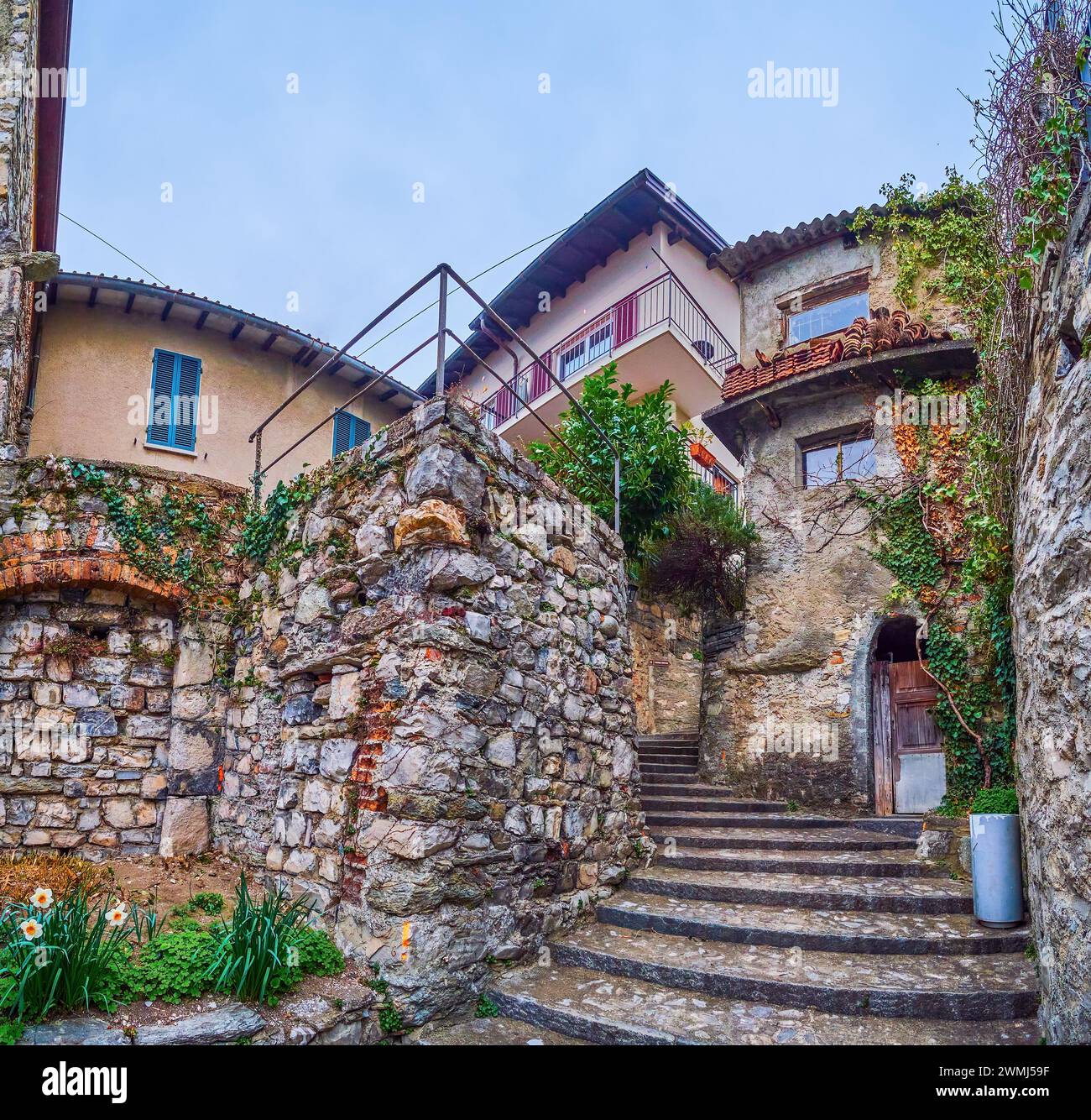 Old stone medieval staircases leading to the upper level of hilly ...