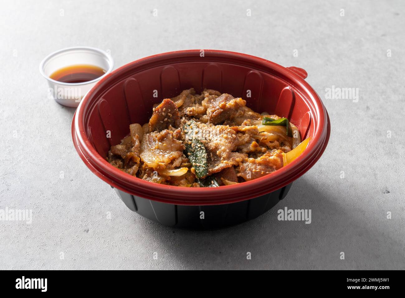 Soy sauce bulgogi, red pepper paste bulgogi over rice Korean food dish ...