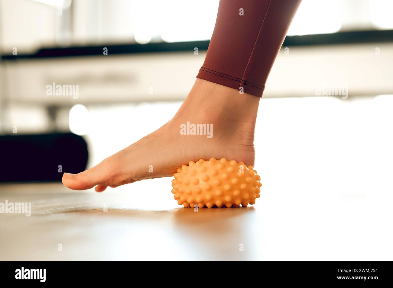Myofascial relaxation of muscles of foot with massage ball Stock Photo ...