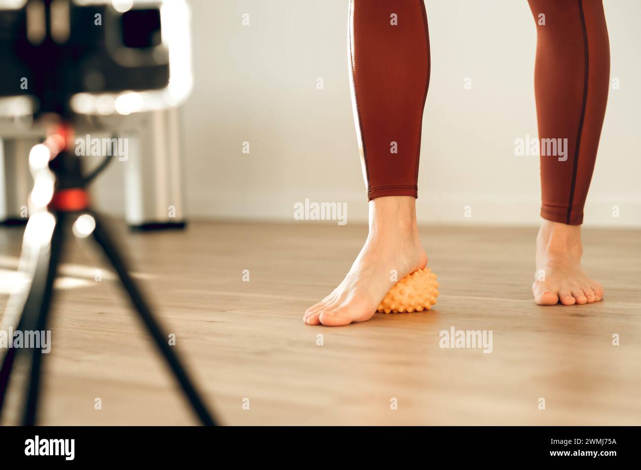 Online stream coach showing technique exercise self massage ball ...