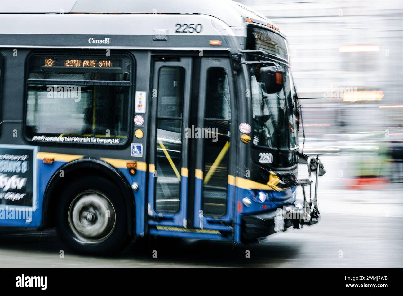 Vancouver, Canada - Feb 21 2024: A bus is crossing Georgia Street ...