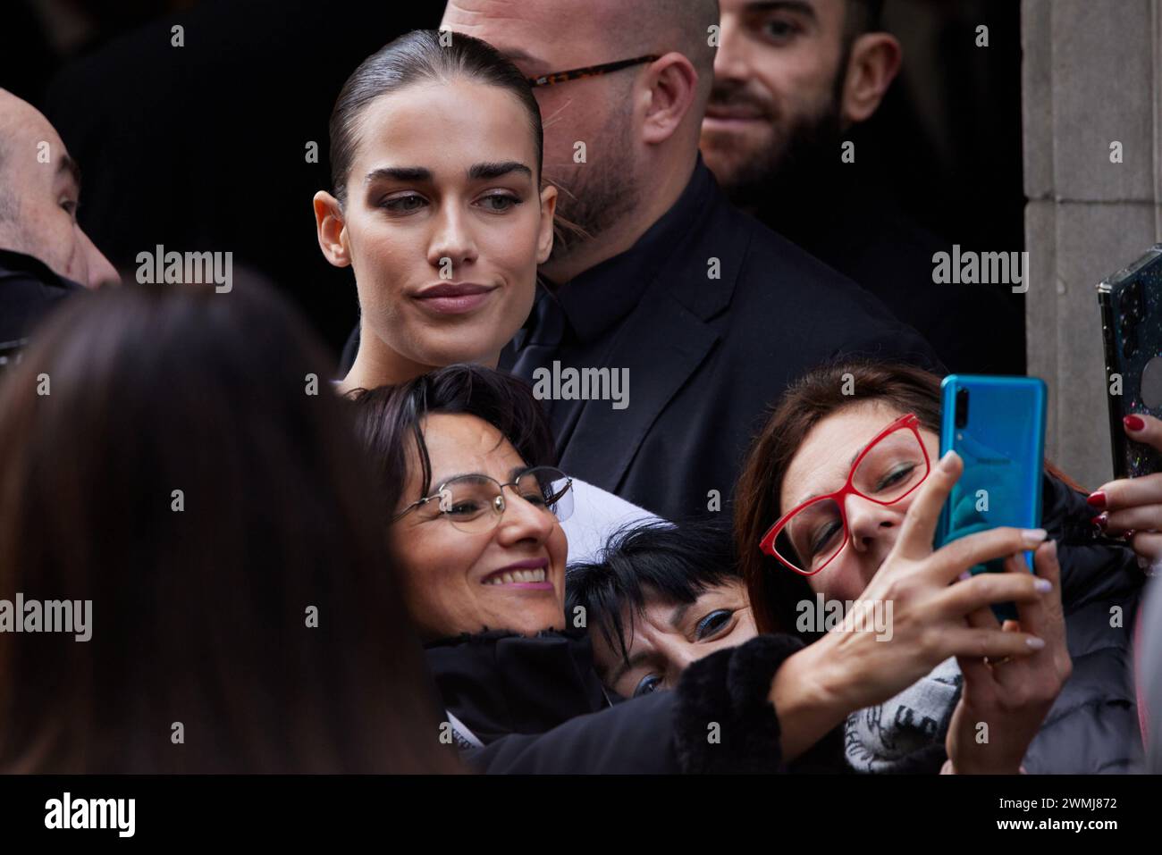Clara Soccini takes selfie with fans outside the Giorgio Armani fashion ...