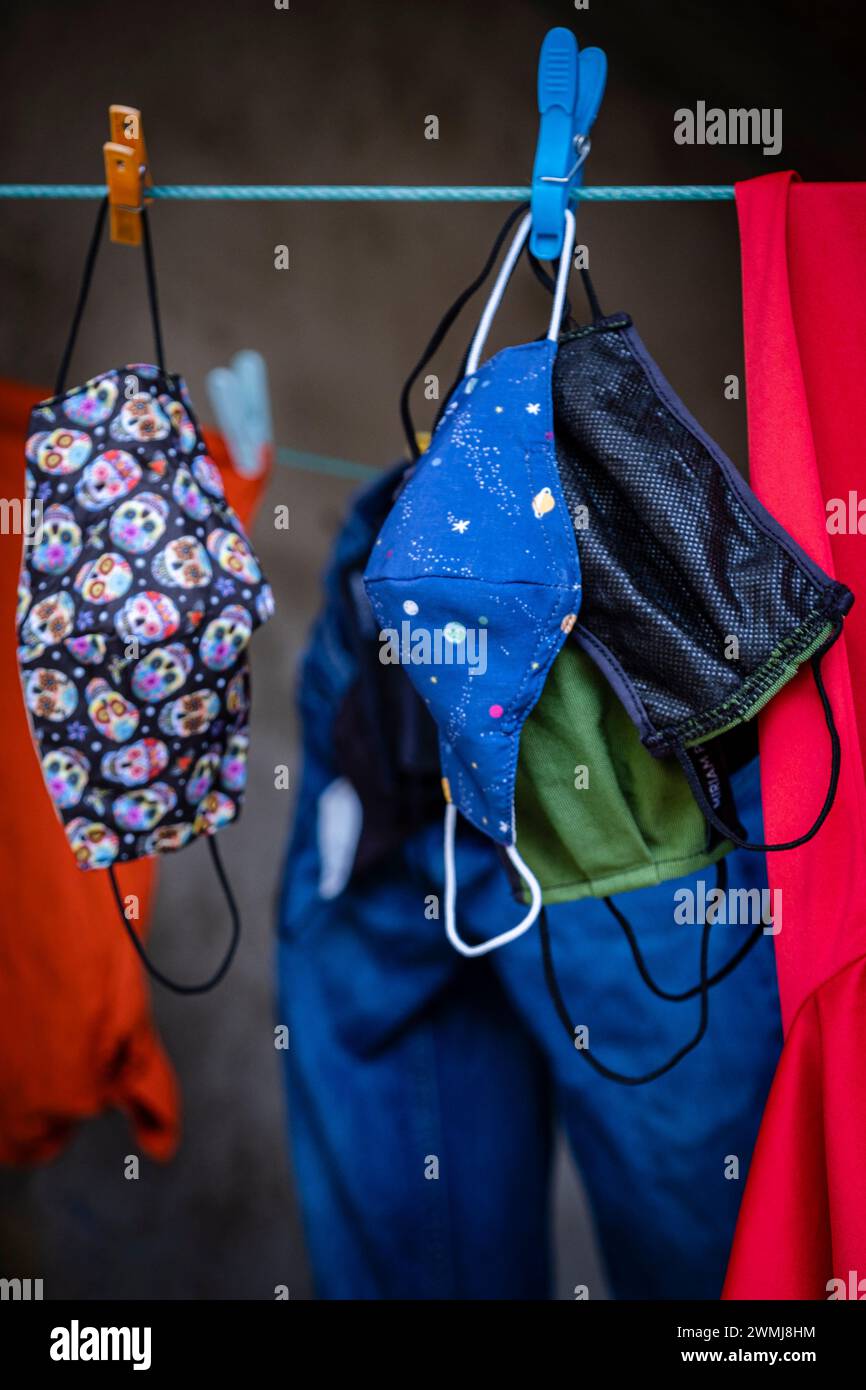 laundry of anti-virus masks hanging in a dryer Stock Photo - Alamy