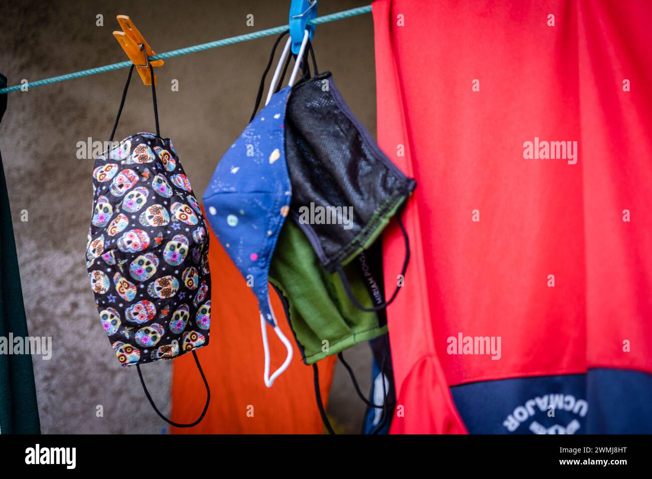 laundry of anti-virus masks hanging in a dryer Stock Photo - Alamy