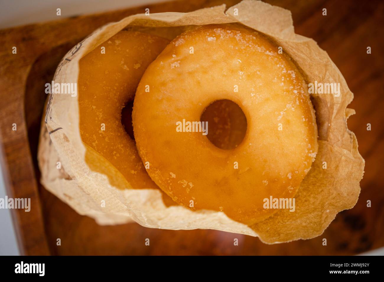 paper bag full of donut Stock Photo - Alamy