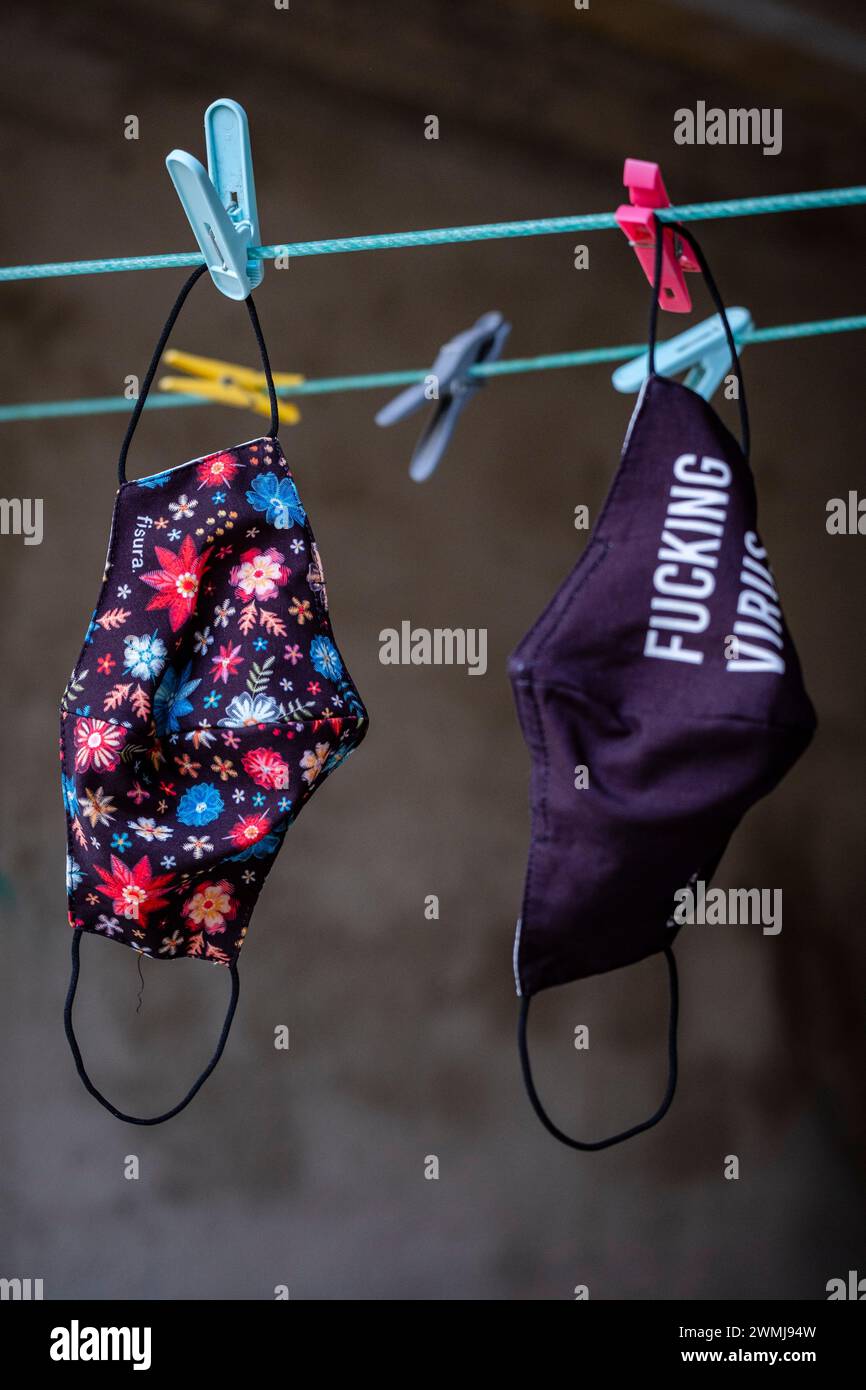 laundry of anti-virus masks hanging in a dryer Stock Photo - Alamy