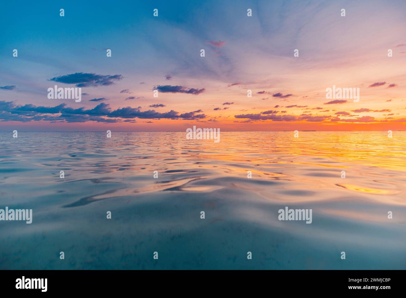 Sea ocean horizon. Skyscape with seascape. Orange and golden sunset sky ...