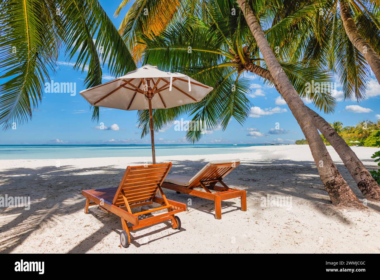 Wonderful beach scenery. Chairs on the sandy beach near the sea ...