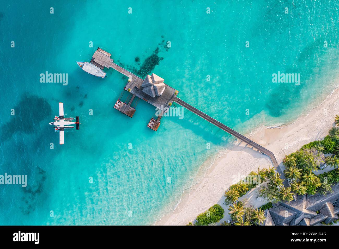 Beautiful aerial view of Maldives jetty seaplane top view with wooden ...