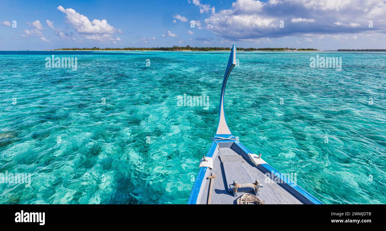 Wooden sailing boat in crystal clear sea tropical lagoon bay close to ...