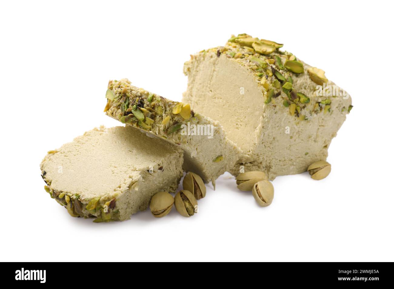 Pieces of tasty halva with pistachios on white background Stock Photo - Alamy