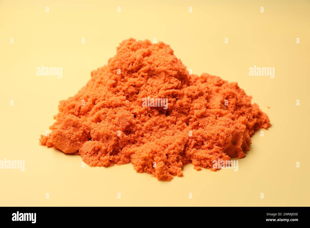 Pile of orange kinetic sand on beige background, closeup Stock Photo ...