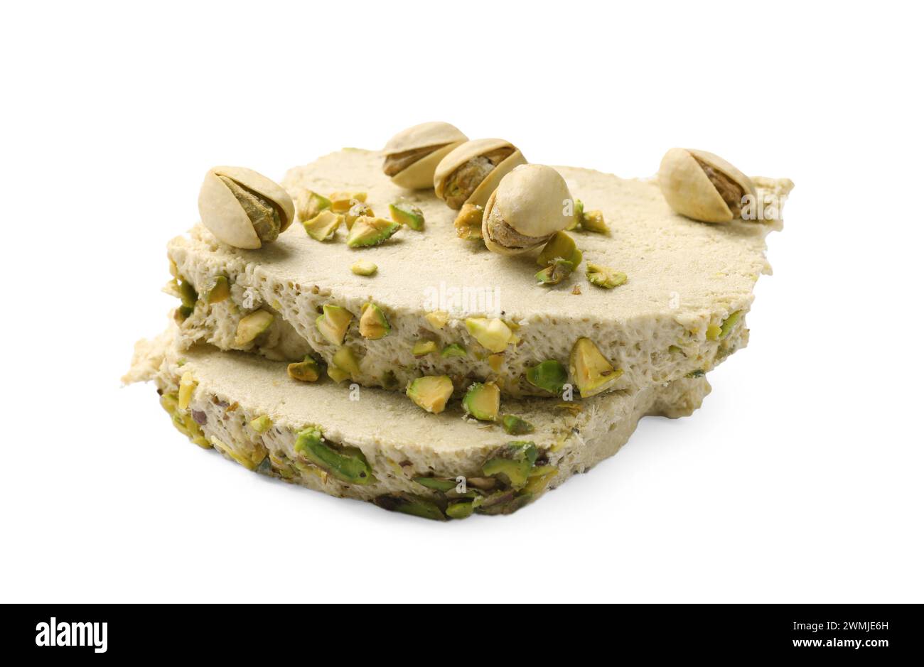 Pieces of tasty halva with pistachios on white background Stock Photo - Alamy