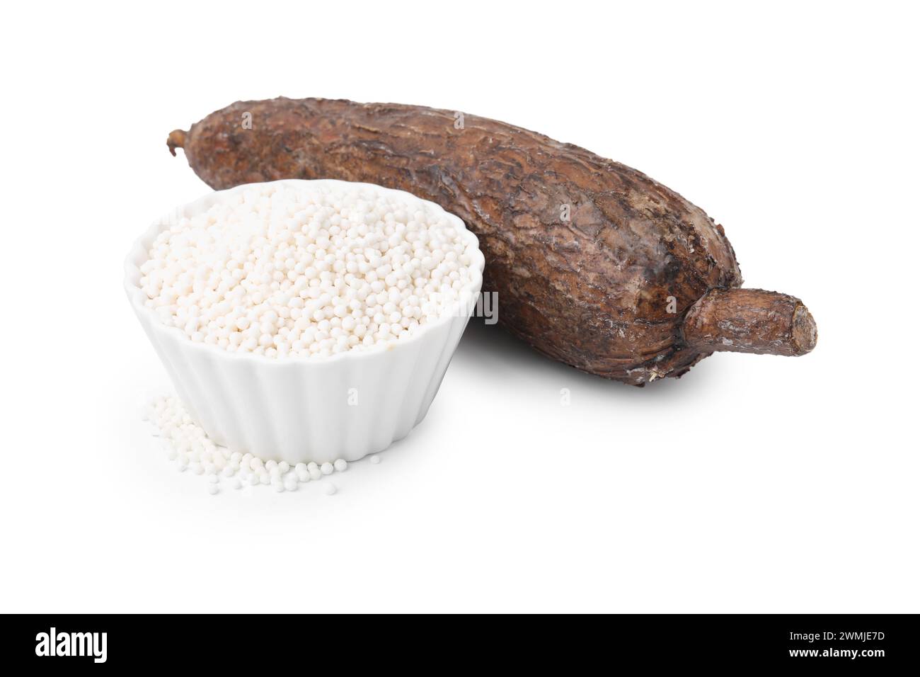 Tapioca pearls in bowl and cassava root isolated on white Stock Photo ...