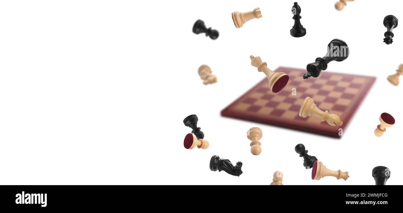 Chess pieces and wooden checkerboard falling on white background Stock ...