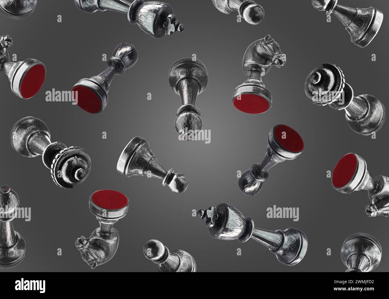 Different black chess pieces falling on grey background Stock Photo - Alamy