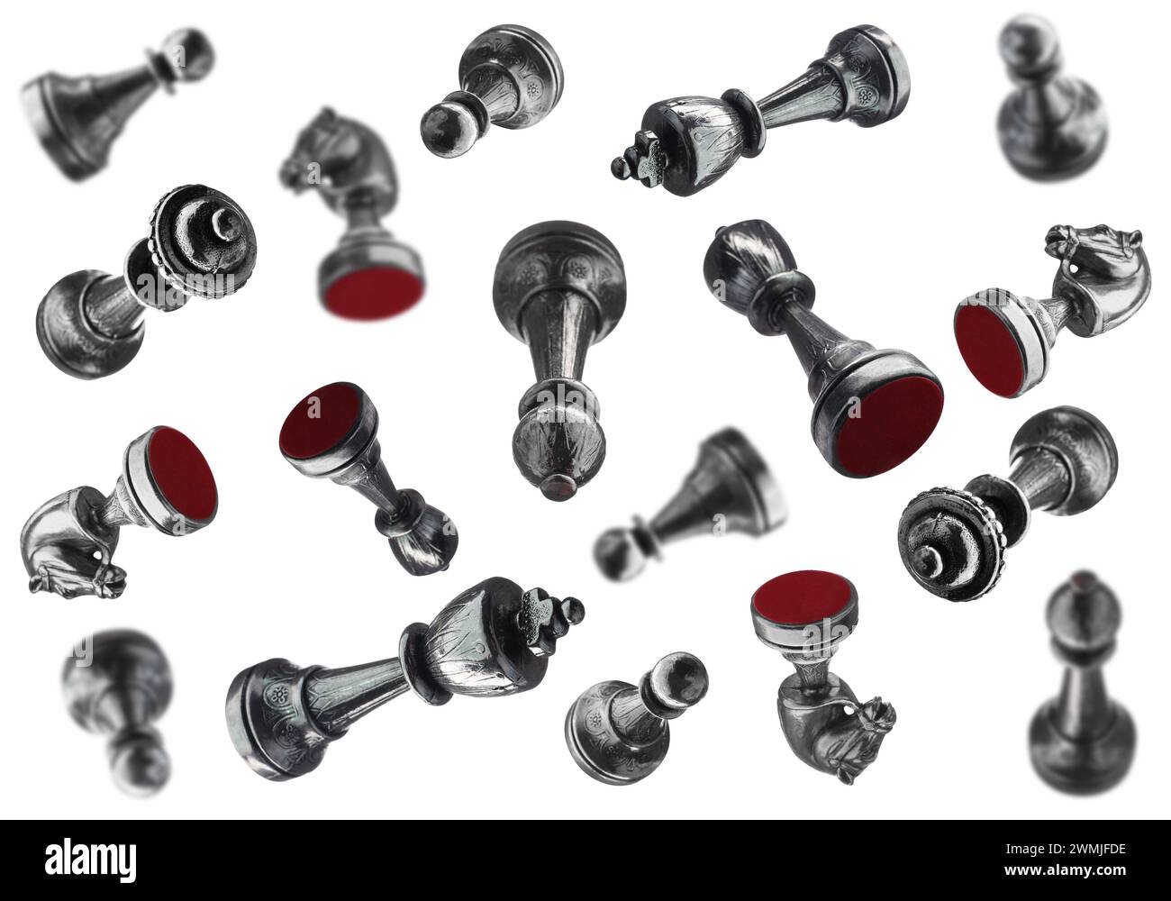 Different black chess pieces falling on white background Stock Photo ...