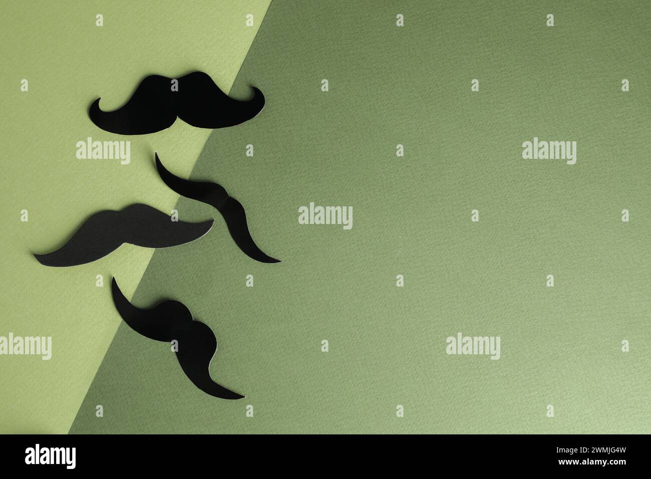Fake paper mustaches on color background, flat lay. Space for text ...