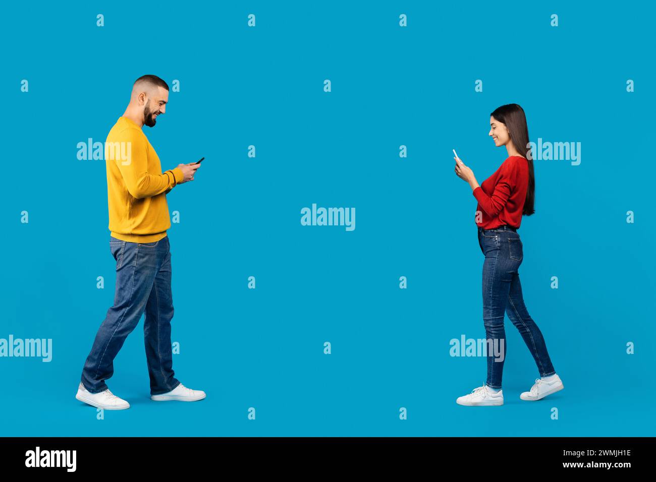 Young man walking past other woman hi-res stock photography and images ...