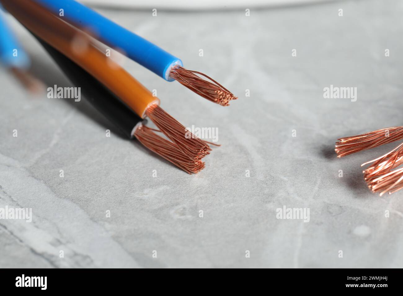 Colorful electrical wires on gray textured surface, closeup Stock Photo ...