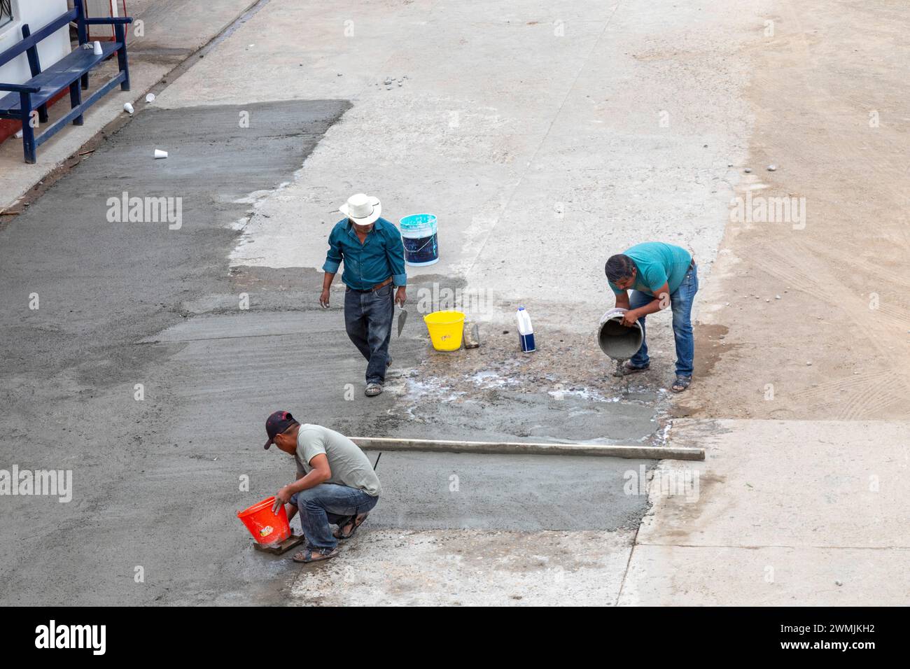 San Miguel del Valle, Oaxaca, Mexico - Workers repair concrete in front ...