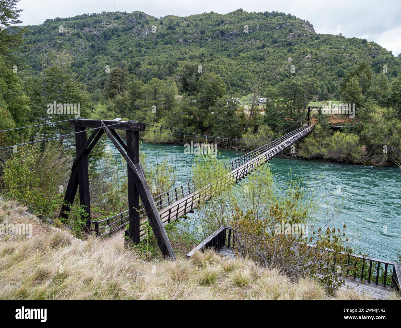 Suspension bridge over river Futaleufu, at school Escuela Rural Las ...