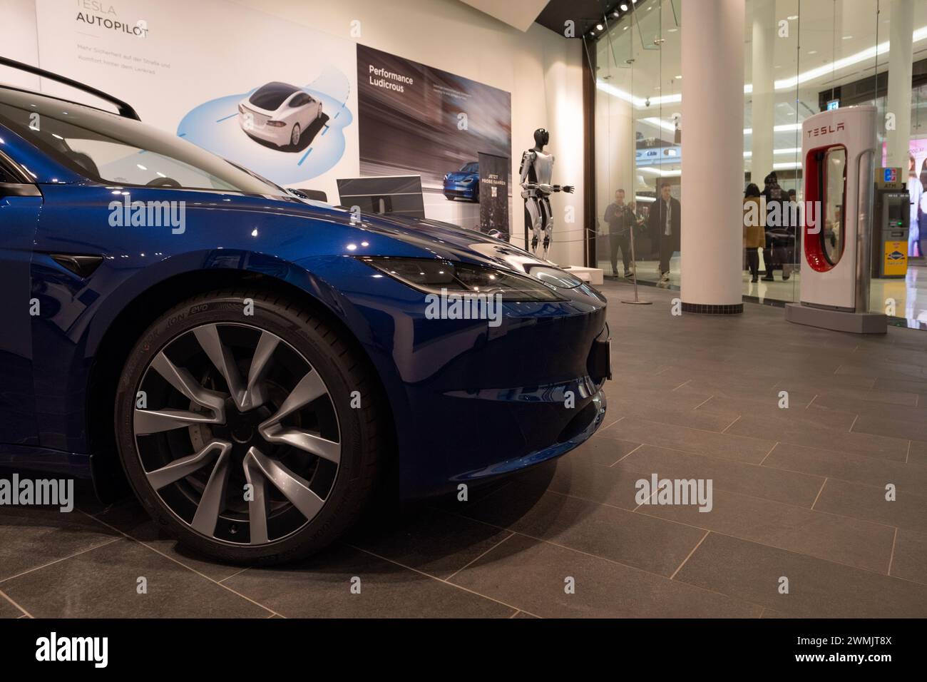 blue Tesla electric car model 3 in Studio, autopilot and eco-friendly ...