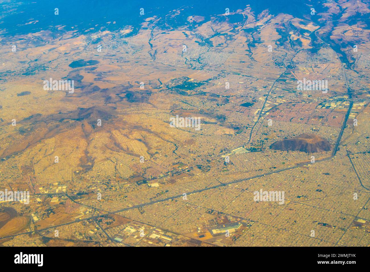 Flying in an airplane over Mexico Clouds Sky Volcanoes Mountains City ...