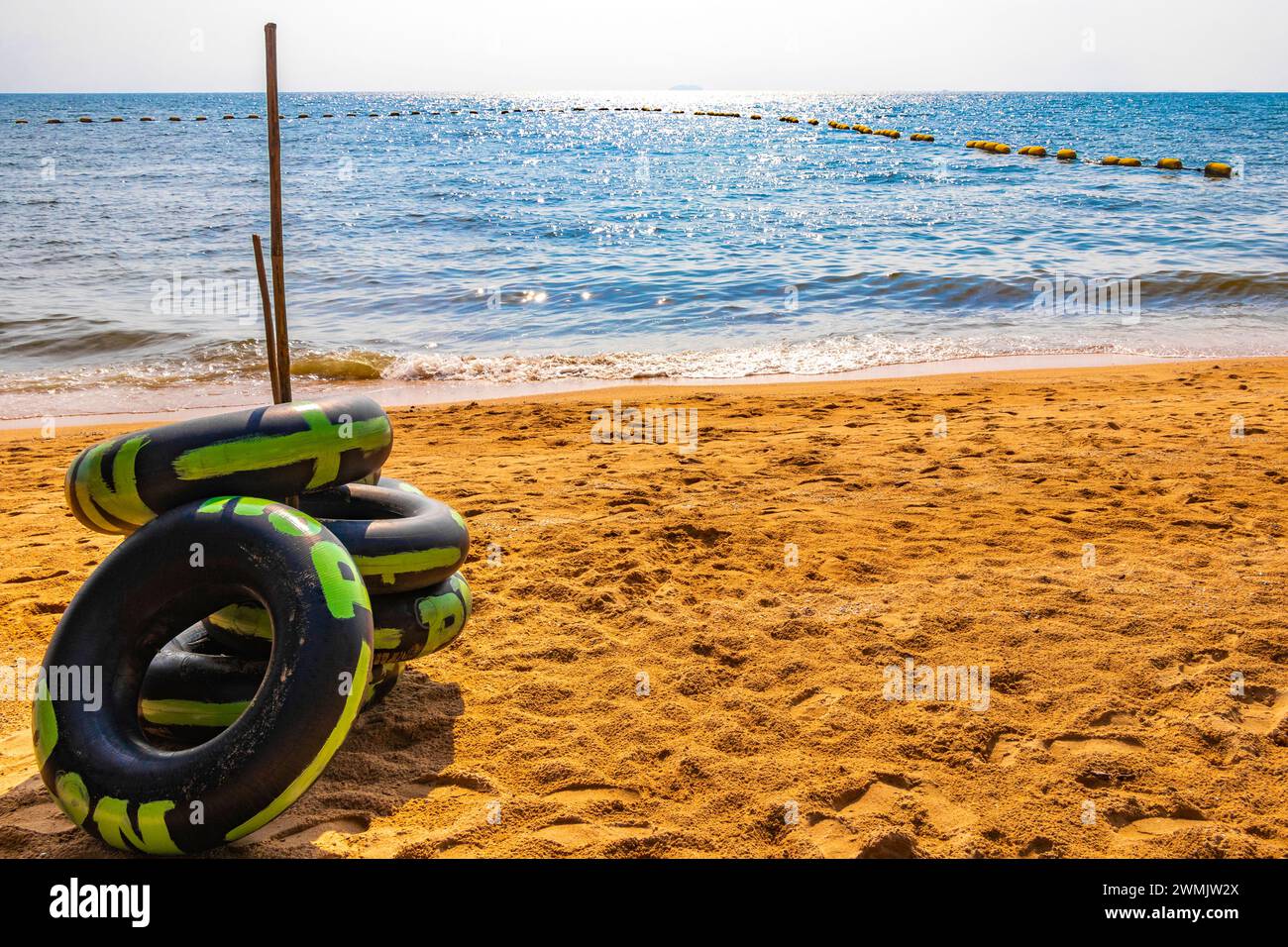 Inflatable floating tires on the beach in Pattaya Bang Lamung Amphoe ...