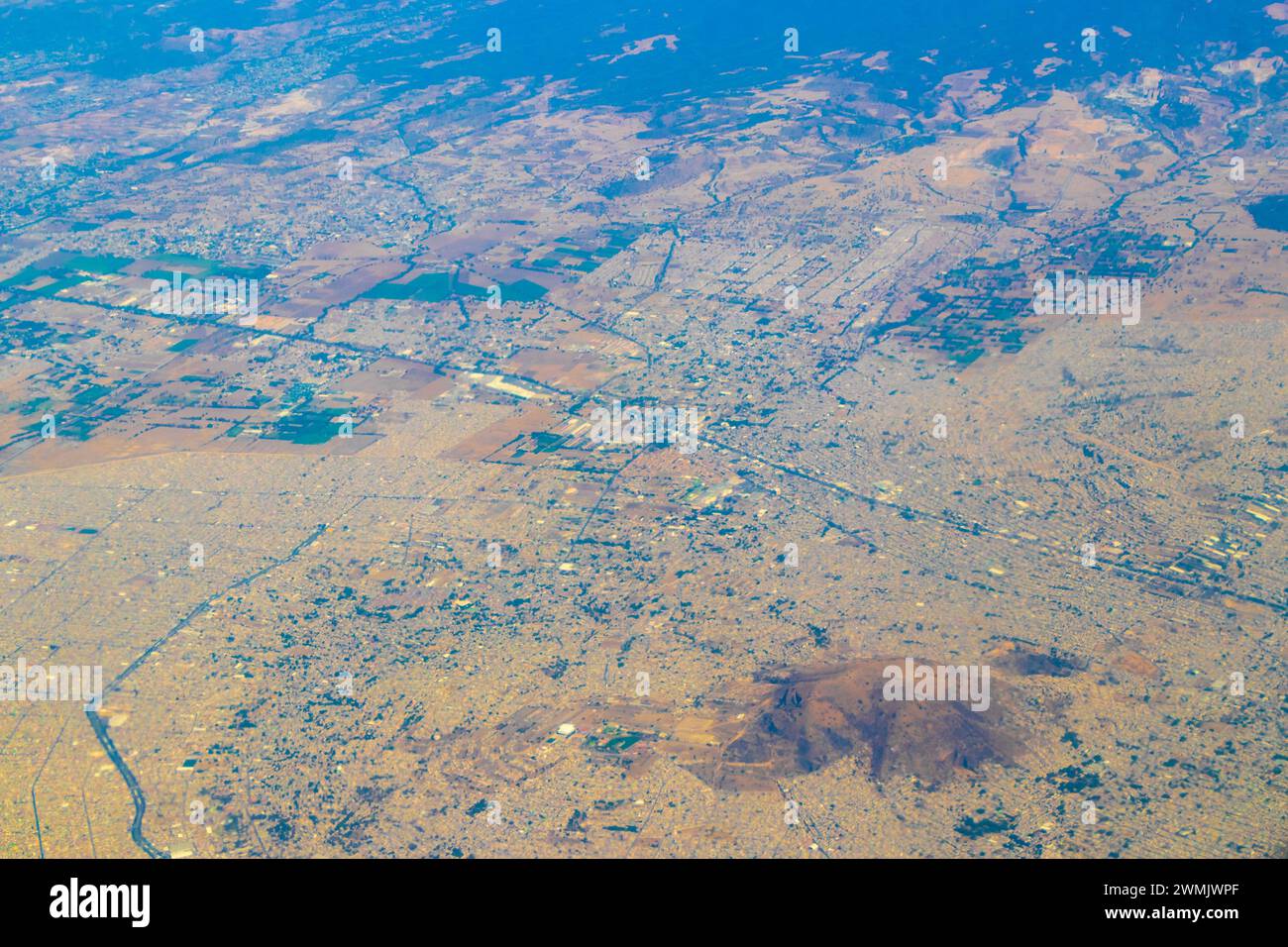 Flying in an airplane over Mexico Clouds Sky Volcanoes Mountains City ...