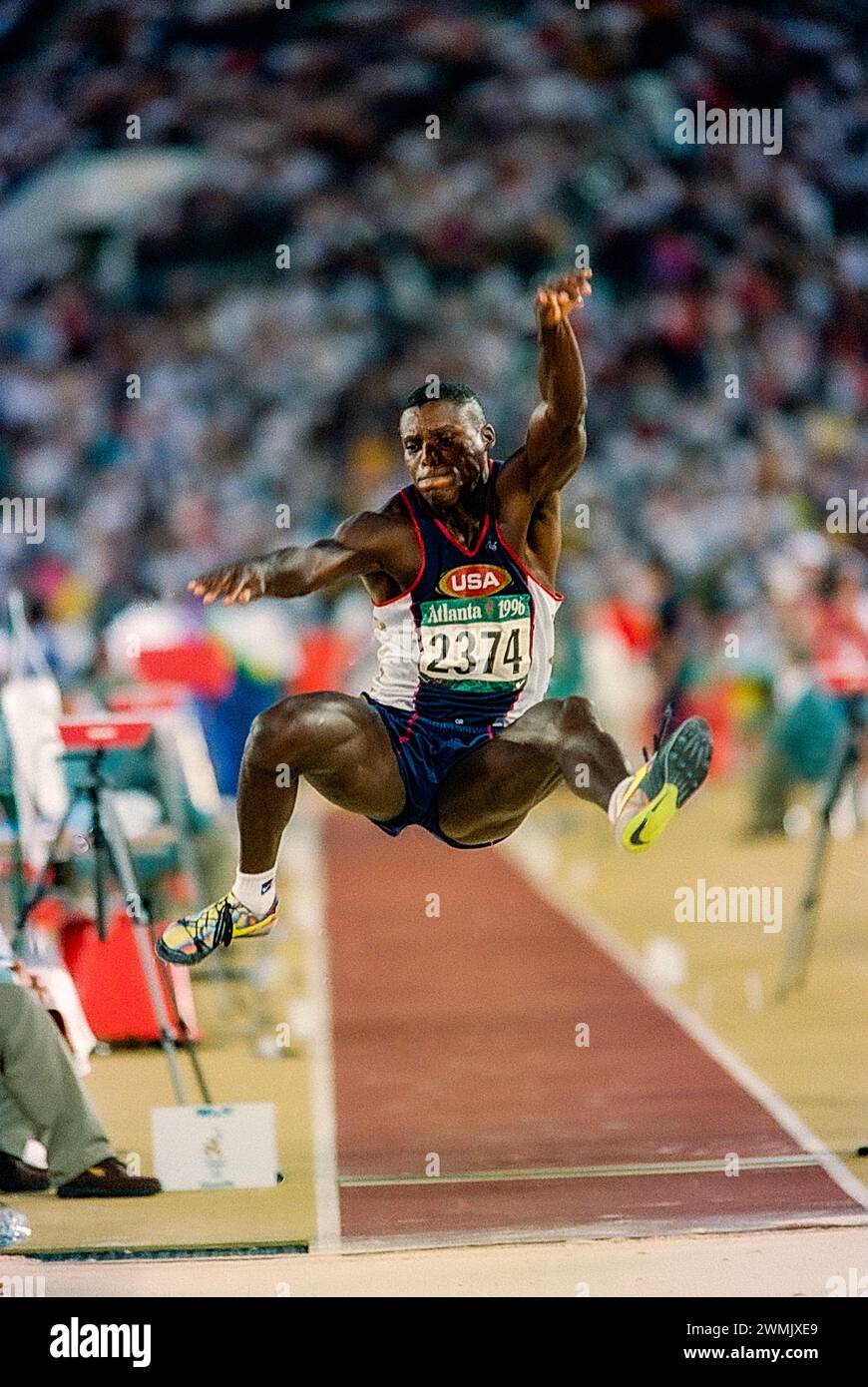 Carl Lewis (USA) win the gold medal in the long jump at the 1996 ...