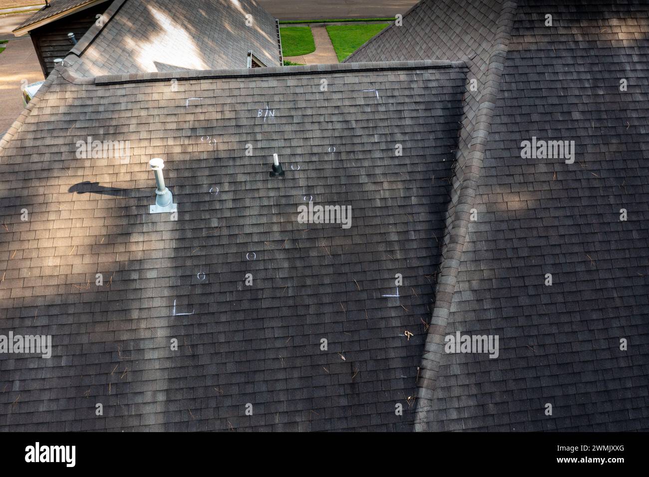 Roof with hail damage and chalk markings from inspection Stock Photo ...