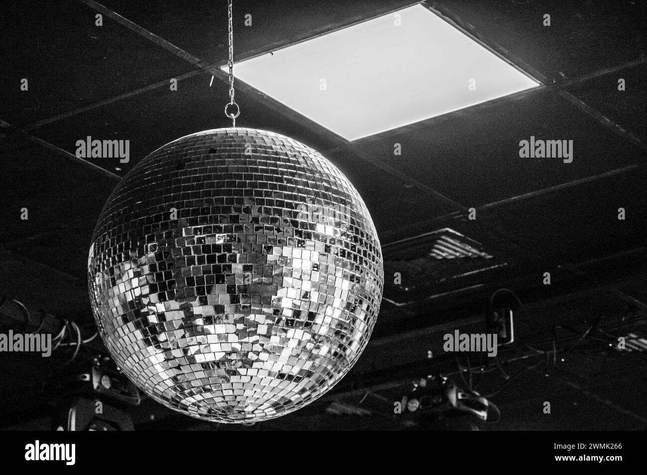 Contrasting elegance. Shimmering disco ball and led ceiling light Stock ...