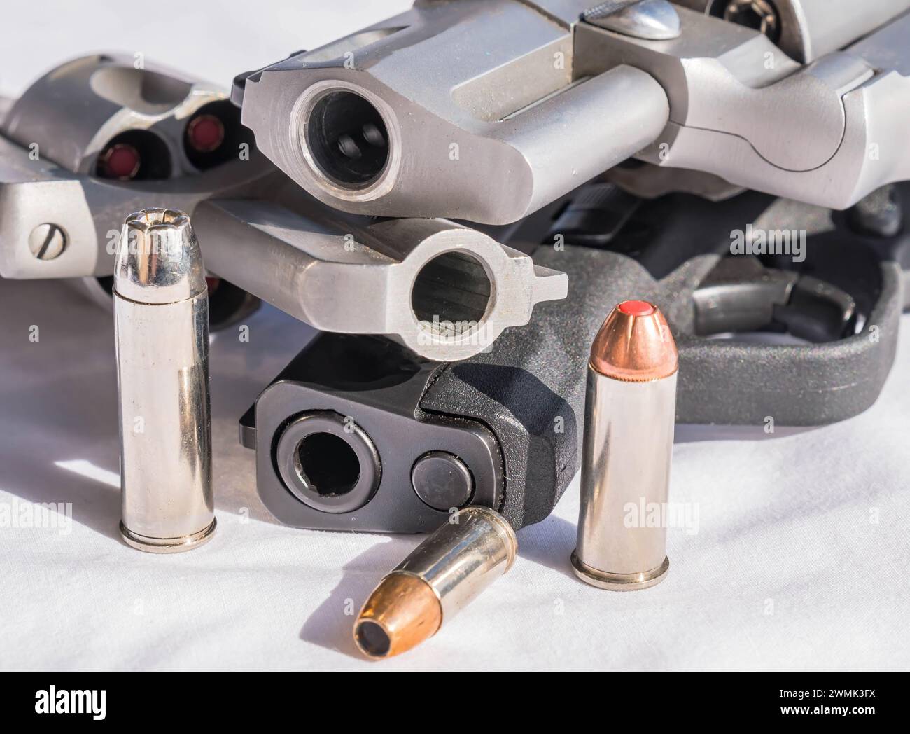 Three handguns, two revolvers and a pistol along with three hollow ...