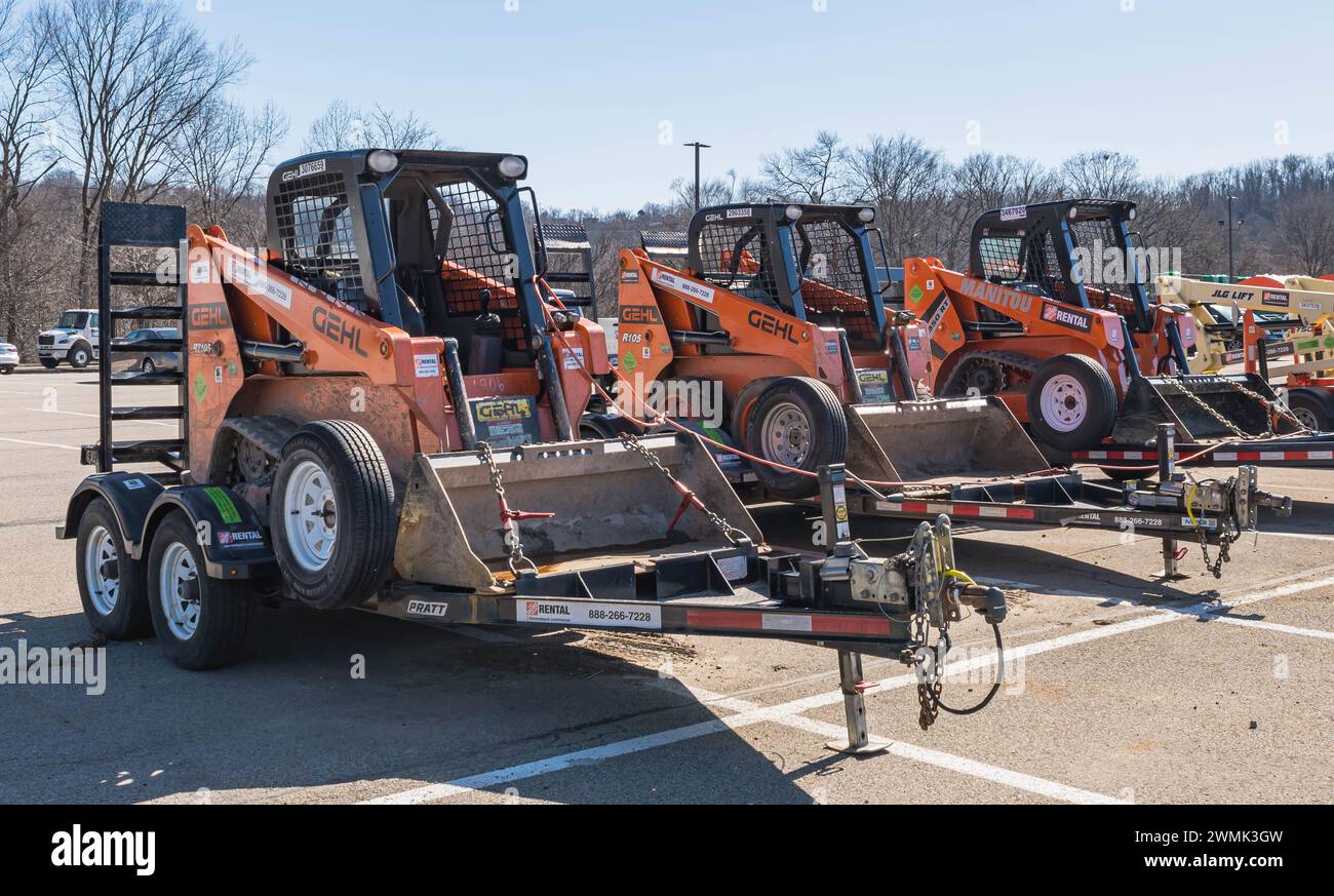 Heavy construction machinery available for rent in the parking lot of ...